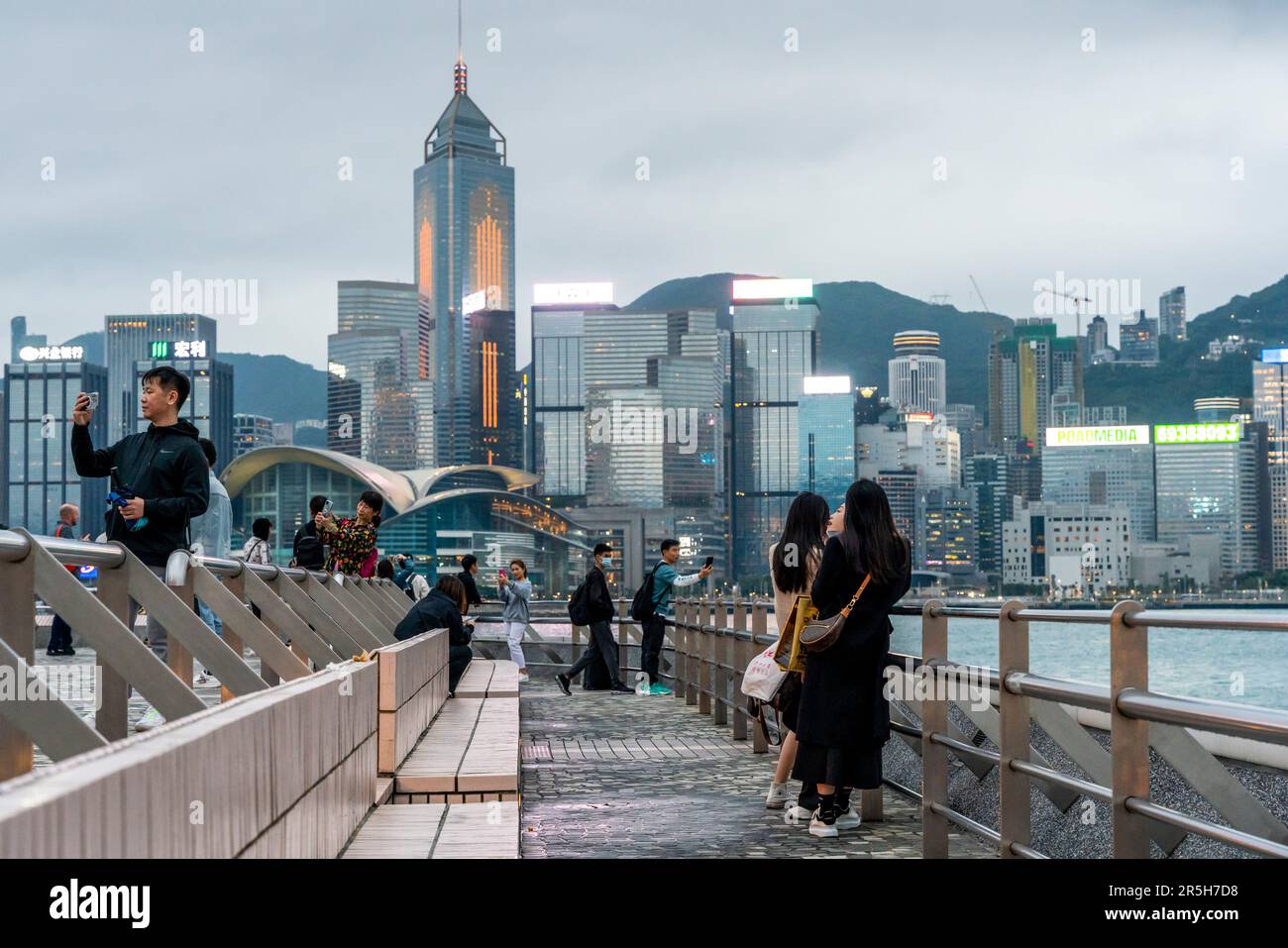 Young People Pose For Photos From The Kowloon Side Across To Hong Kong ...