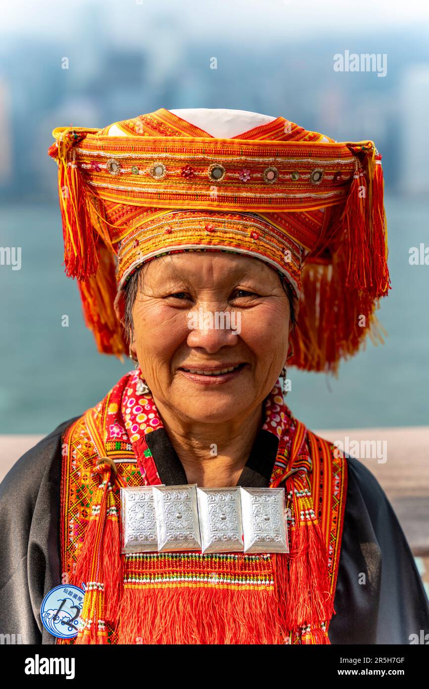 A Chinese Domestic Visitor In Traditional Costume Poses For A Photo On ...