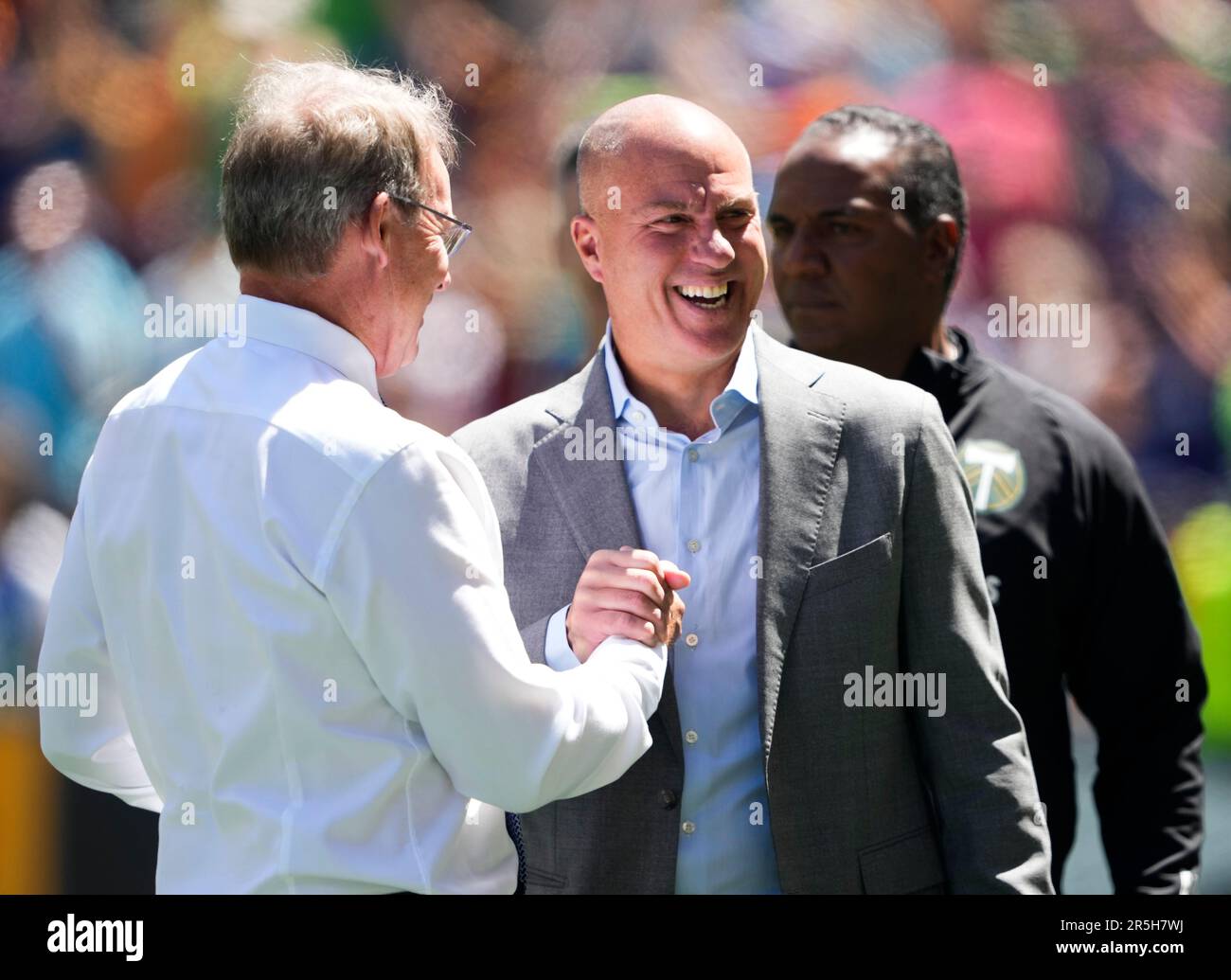 Seattle Sounders head coach Brian Schmetzer, left, greets Portland ...