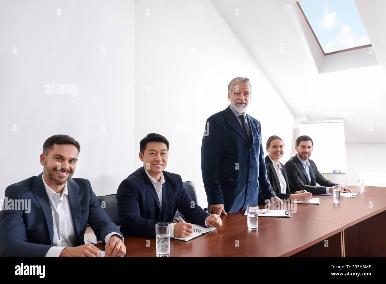 Business conference. People in meeting room listening to speaker report ...