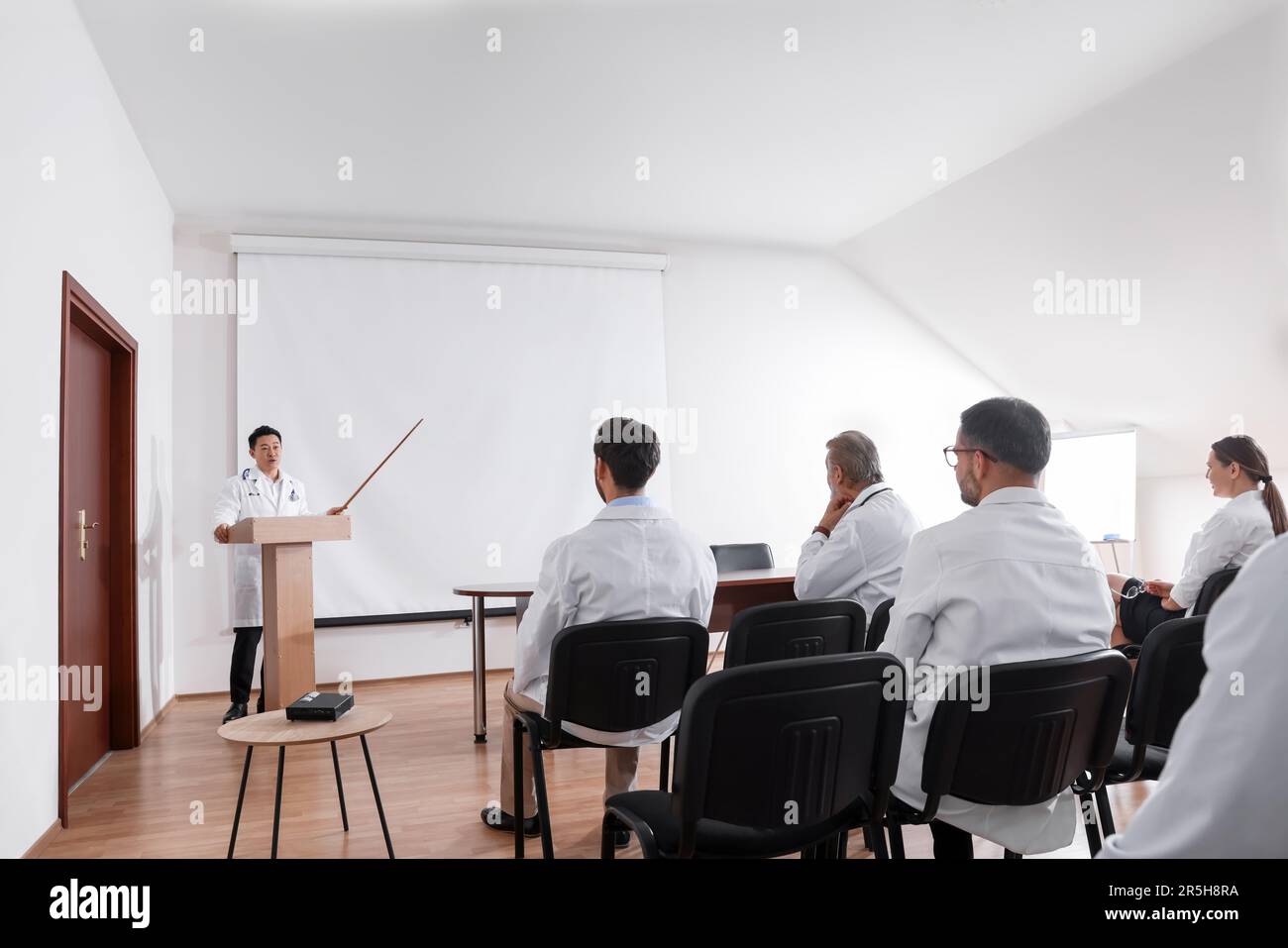 Female doctor giving presentation in hi-res stock photography and ...