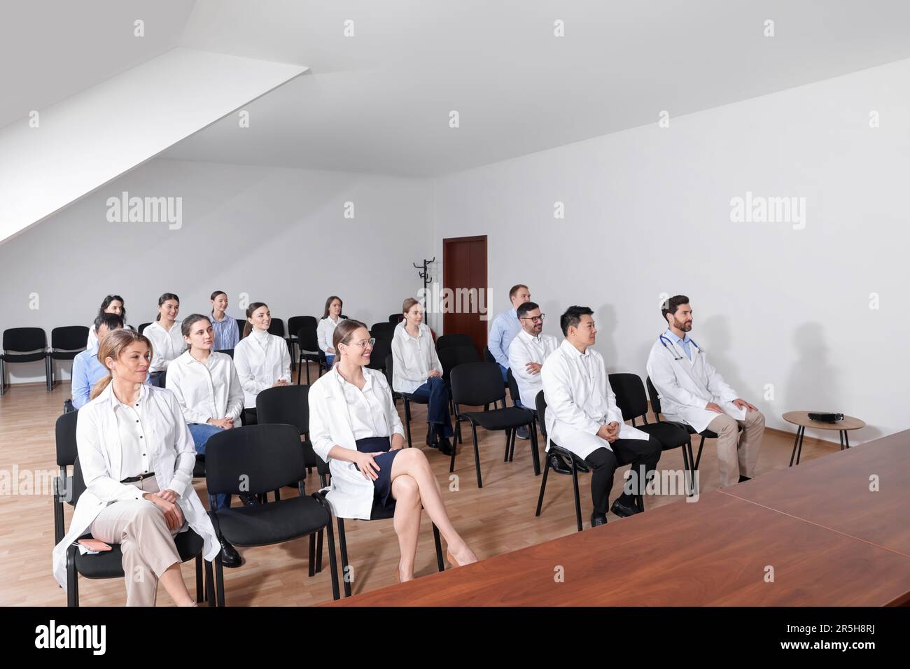 Team of doctors in meeting room during medical conference Stock Photo ...