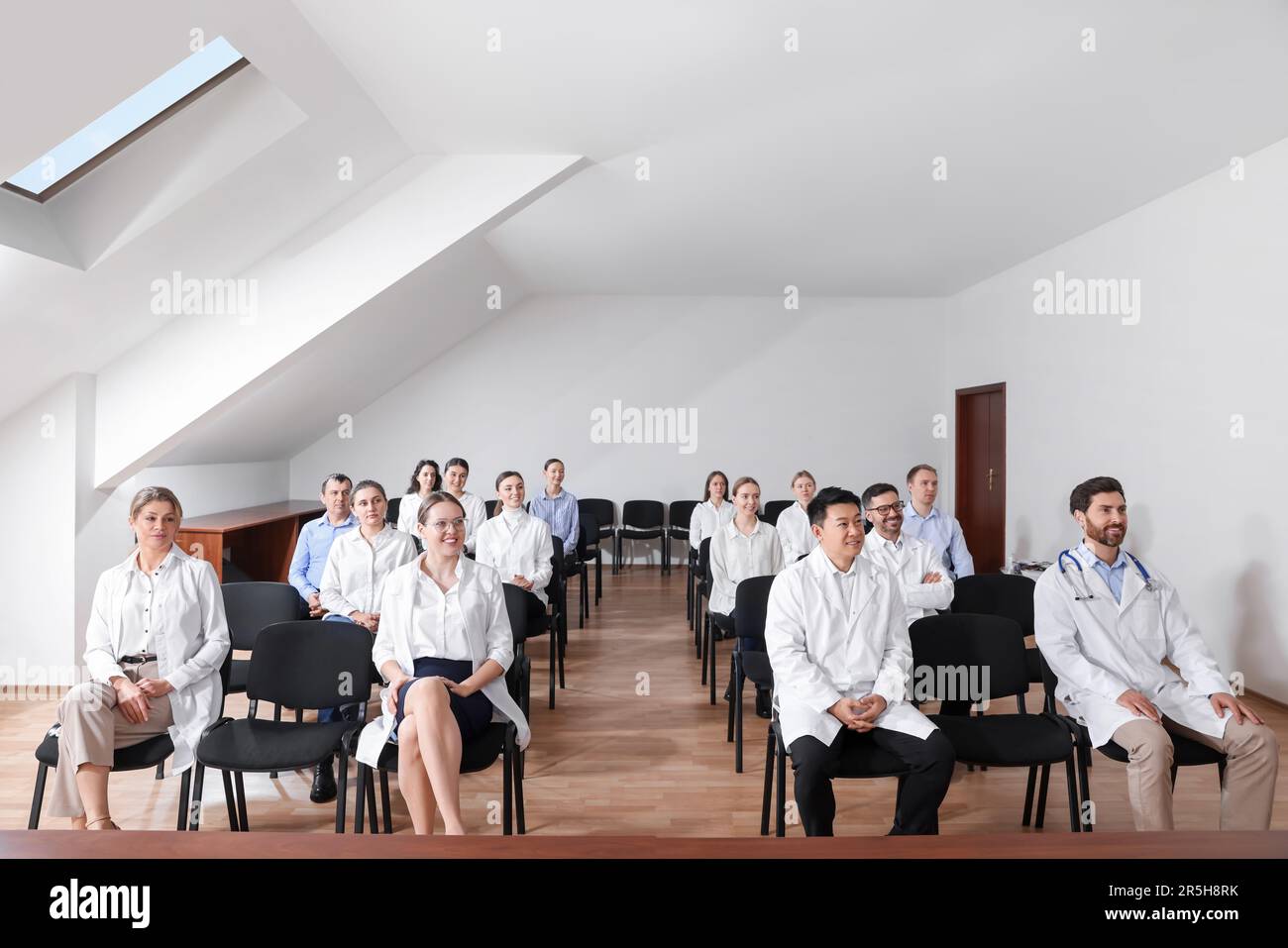 Team of doctors in meeting room during medical conference Stock Photo ...