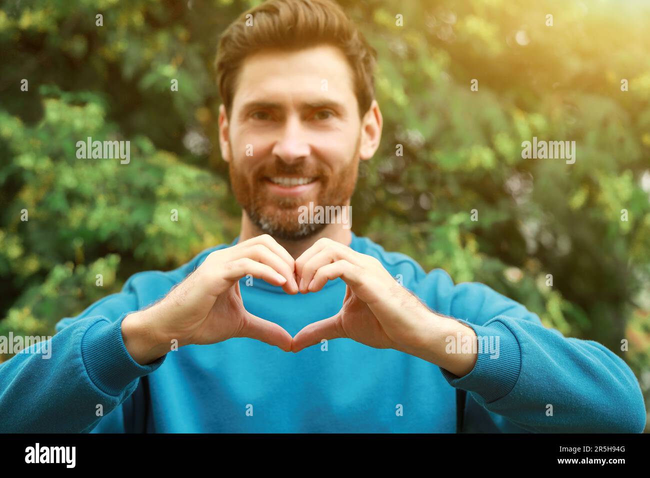 Man making heart gesture hi-res stock photography and images - Alamy