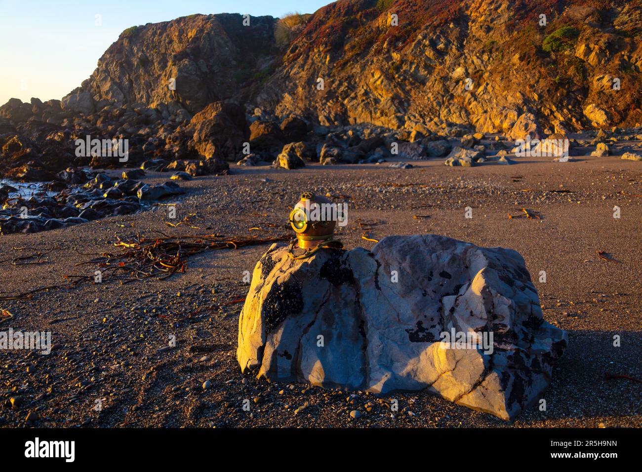 Shoreside Diving Helmet Sitting On A Large Sea Side Rock Still life ...