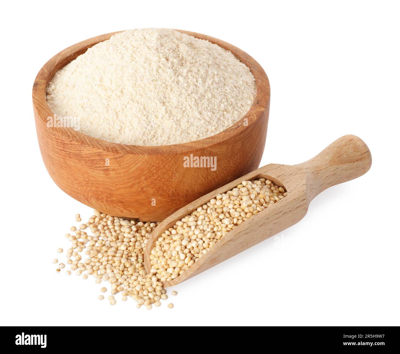 Quinoa flour in wooden bowl and scoop with seeds on white background ...