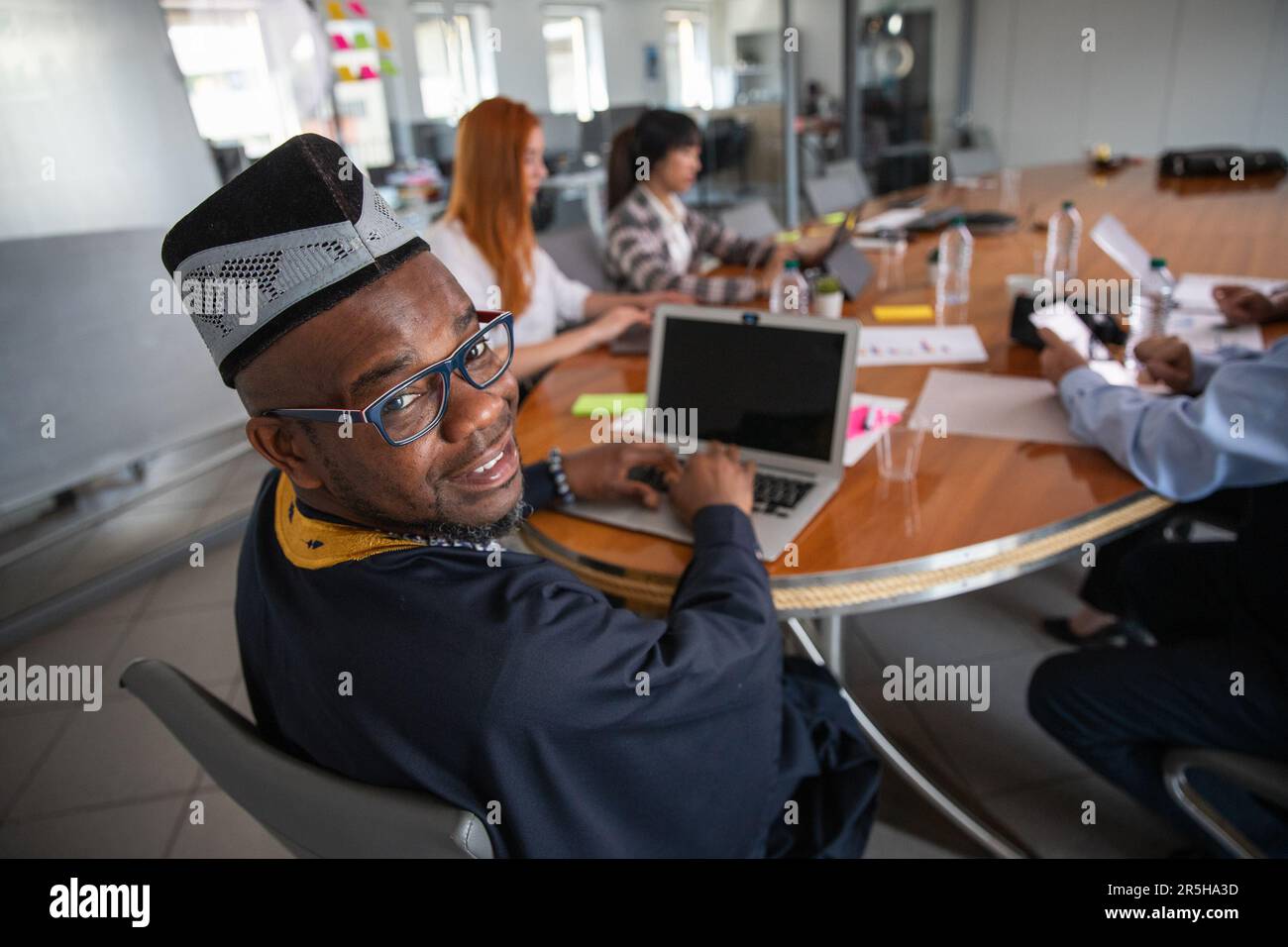 African businessman wearing traditional attire during a business ...