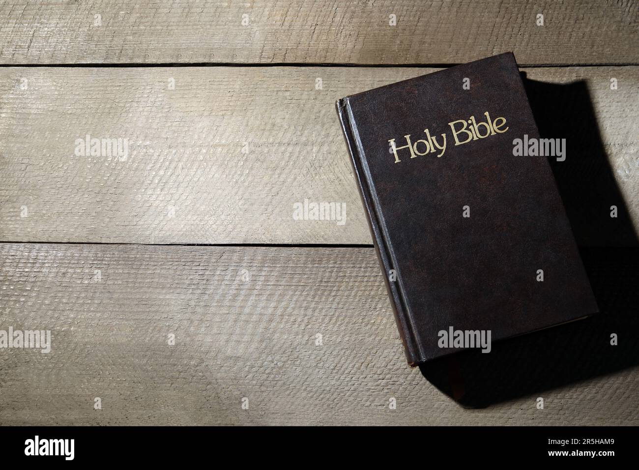 Holy Bible on wooden table, top view. Space for text Stock Photo - Alamy