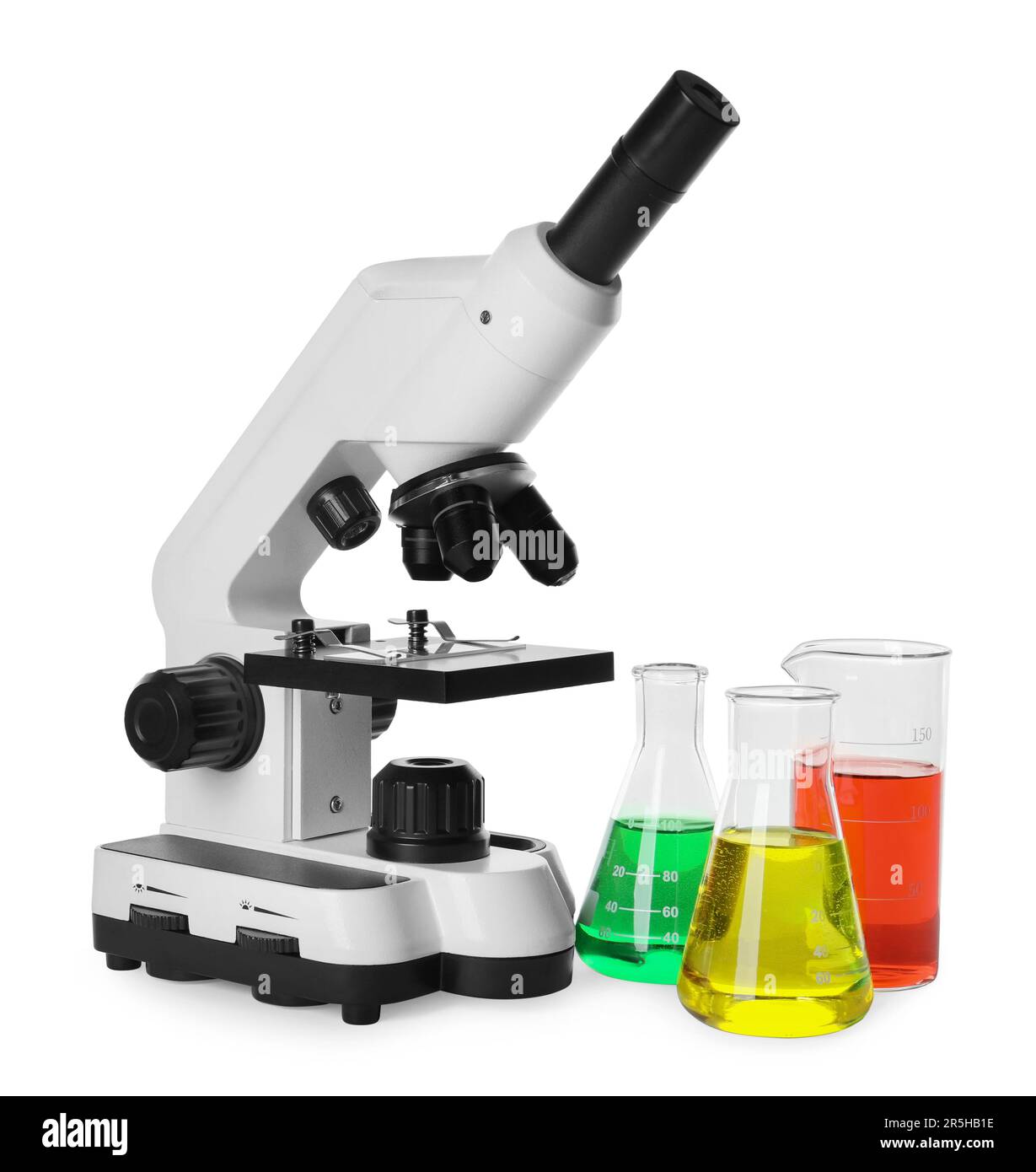 Laboratory glassware with colorful liquids and microscope isolated on ...
