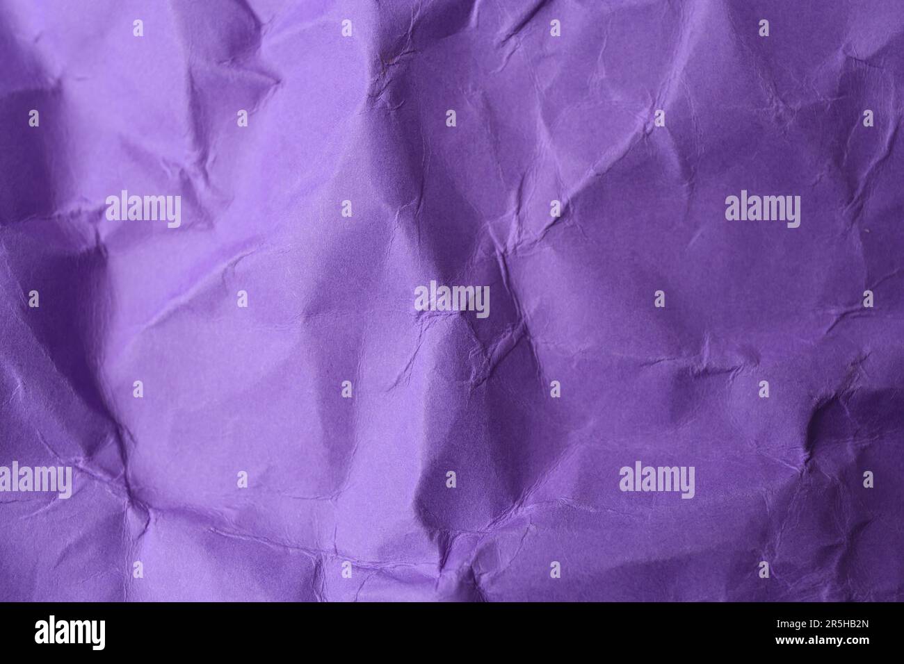 Sheet of crumpled violet paper as background, top view Stock Photo - Alamy