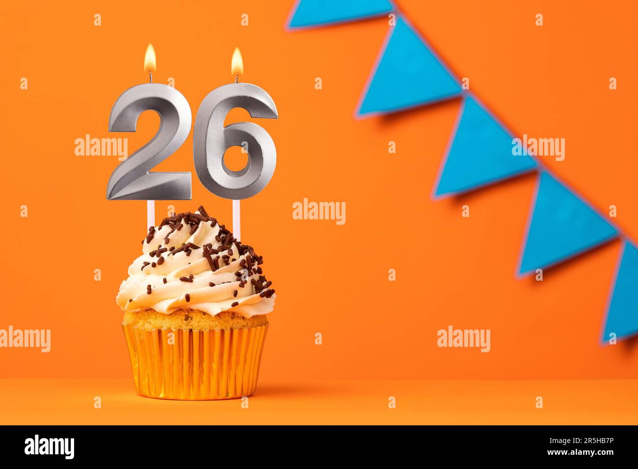 Birthday cake with candle number 26 - Orange background Stock Photo - Alamy