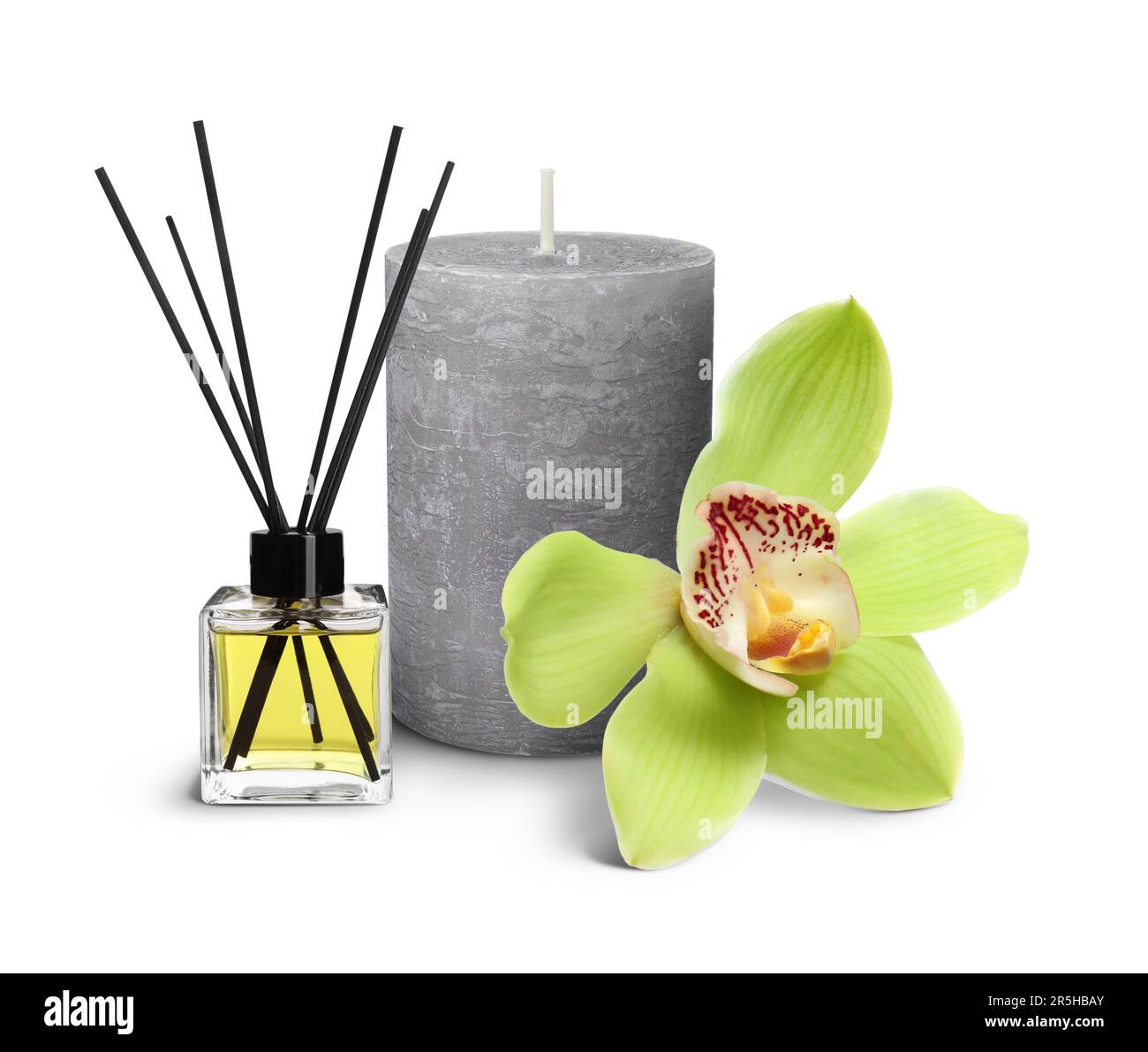 Beautiful composition with reed diffuser, candle and orchid flower on ...