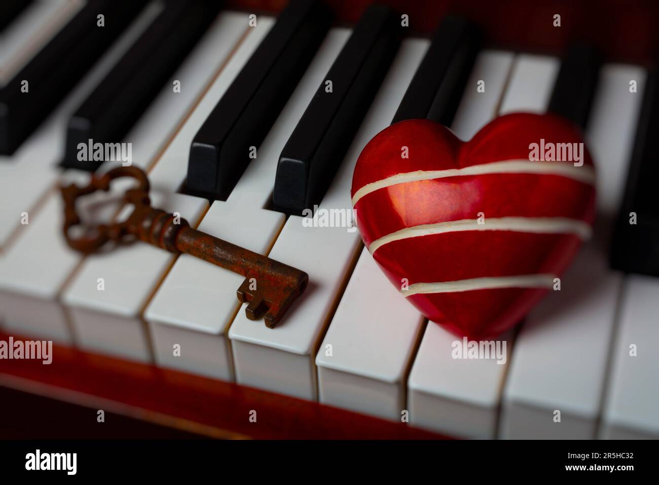 Red Heart And Skeleton key On Piano Keys Stock Photo - Alamy