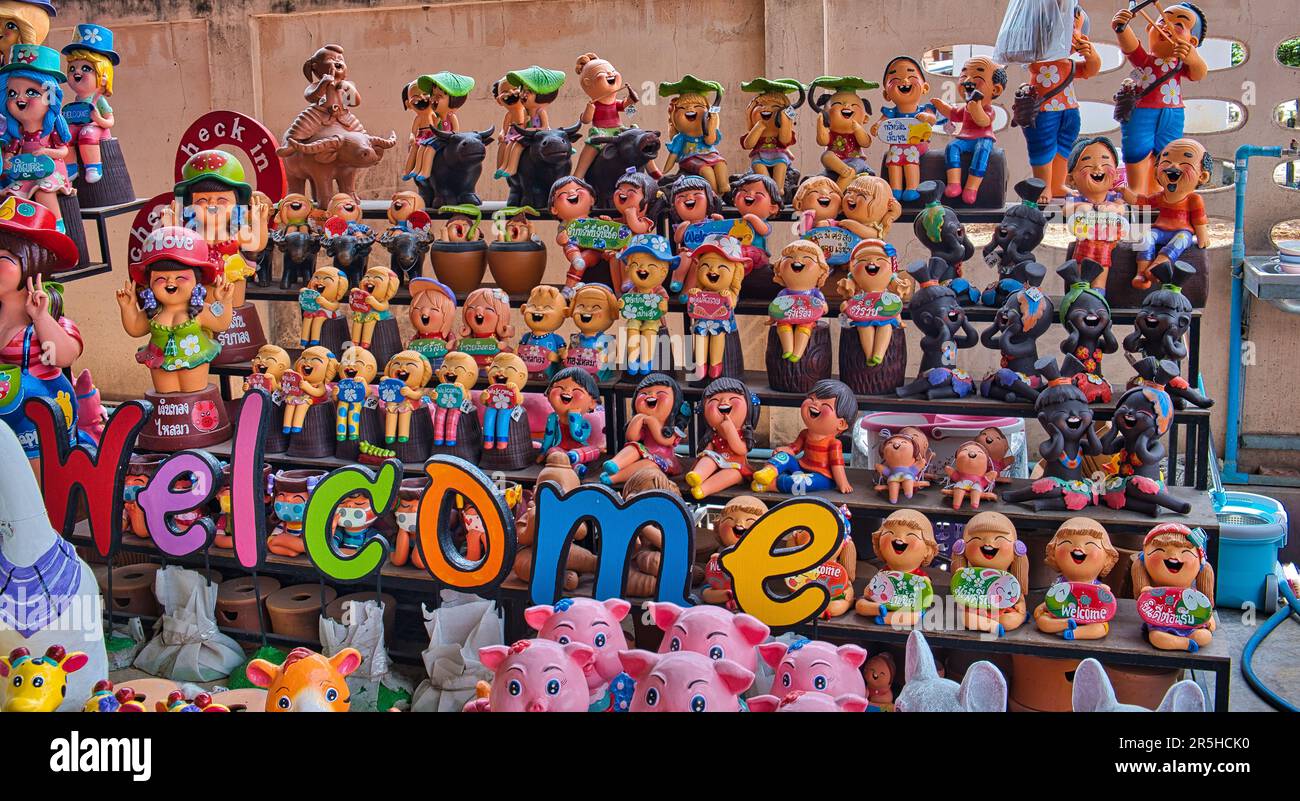 Ceramic statues of laughing boys and girls, to be used as welcome signs ...