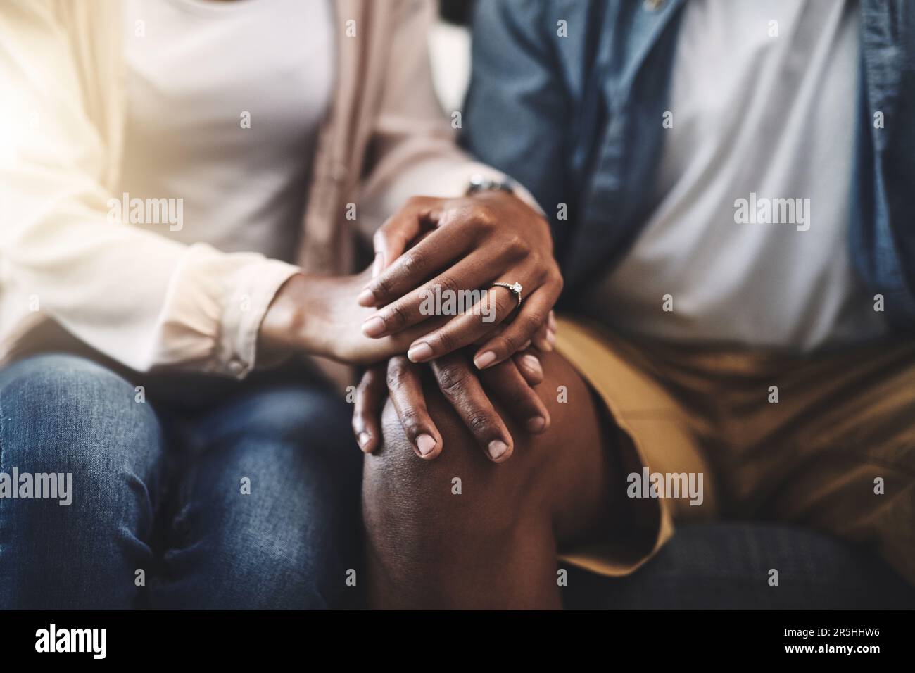 African woman sitting hands on legs hi-res stock photography and images ...