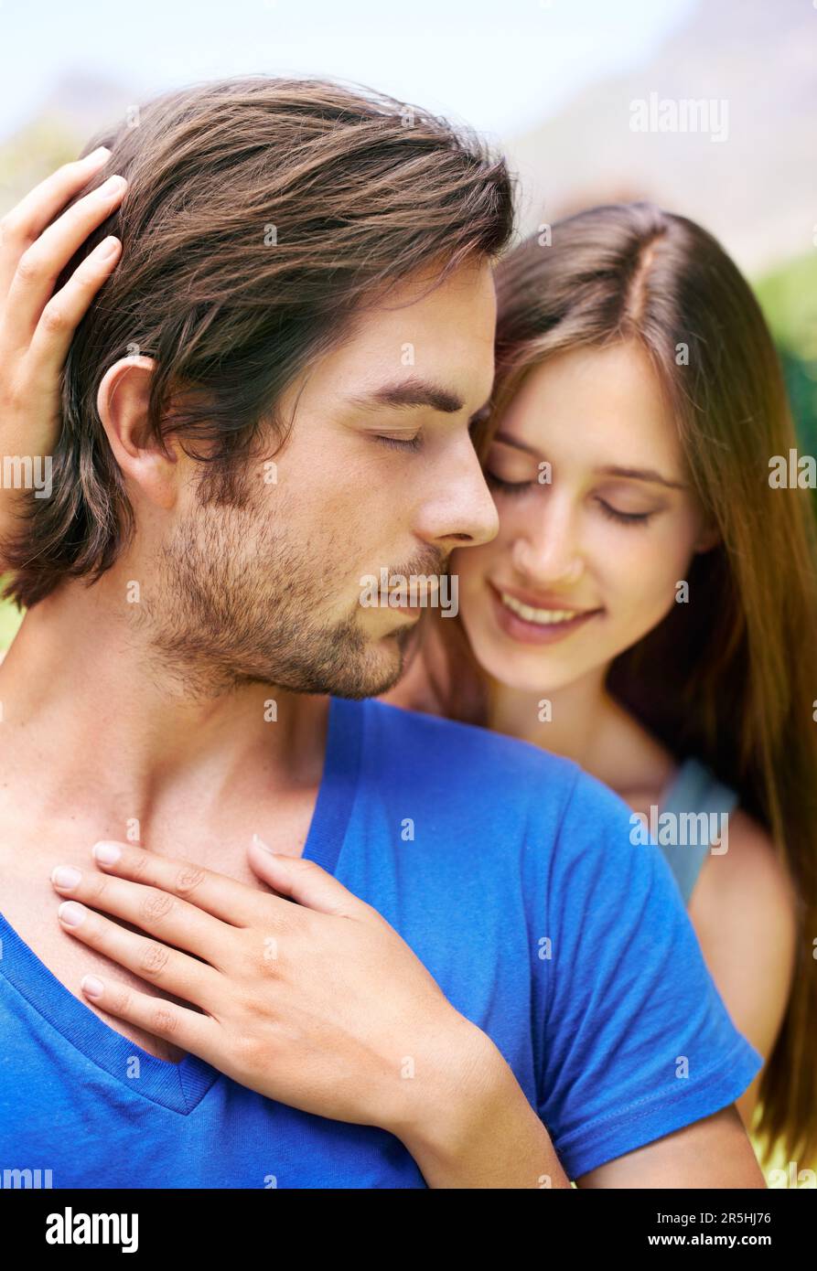 Sharing A Sweet Summer Romance A Loving Couple Embracing With Their