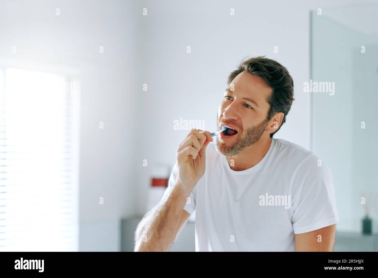 I look after my teeth so I can keep them longer. a handsome middle aged ...