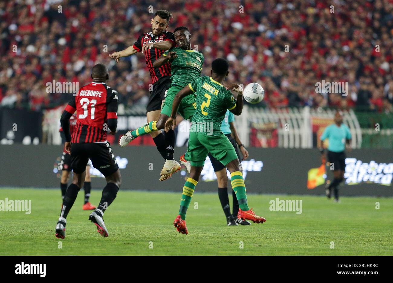 Algiers. 4th June, 2023. USM Alger's Islam Merili (2nd L) vies with ...