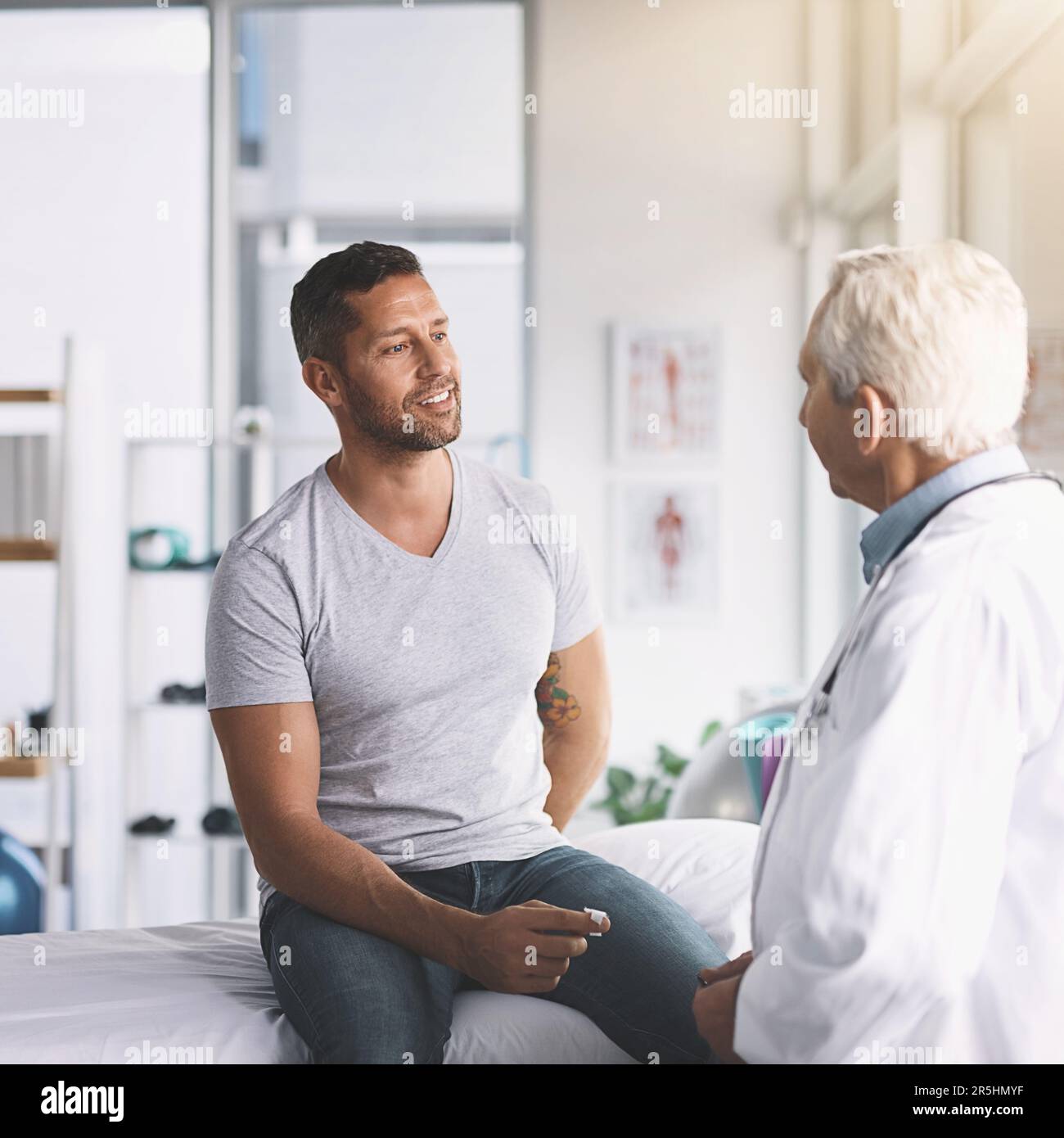 How an I doing, doc. a senior doctor giving his male patient a thorough ...