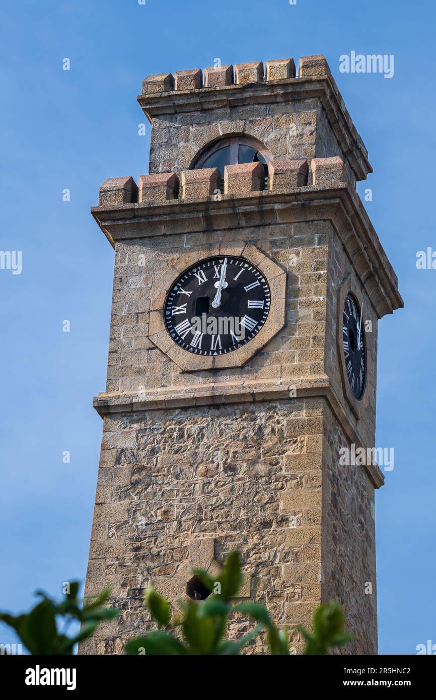 Galle Fort clock tower upper part close up shot against the blue skies ...