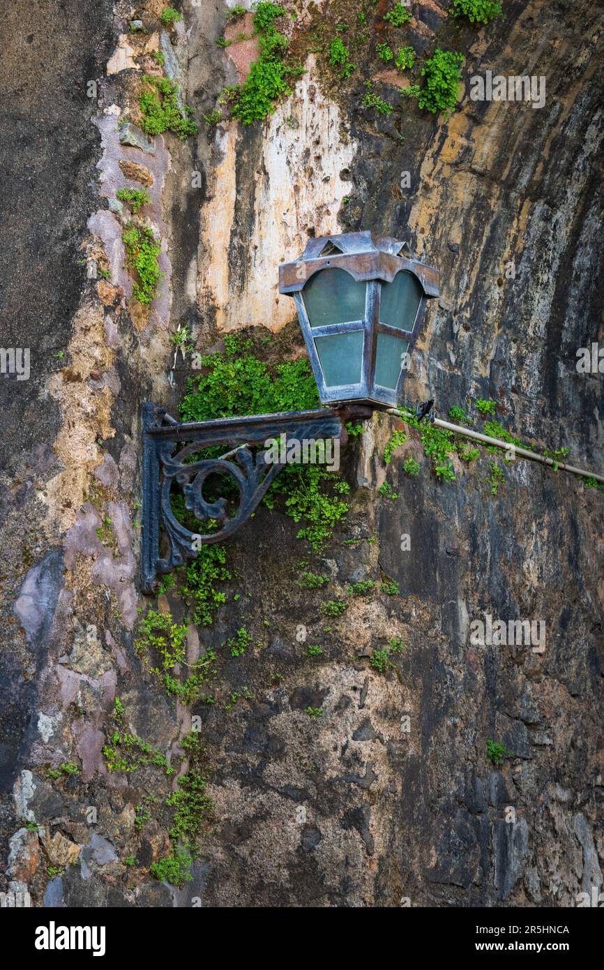 Old colonial-style decayed street lamp on the Galle Fort arch entrance ...