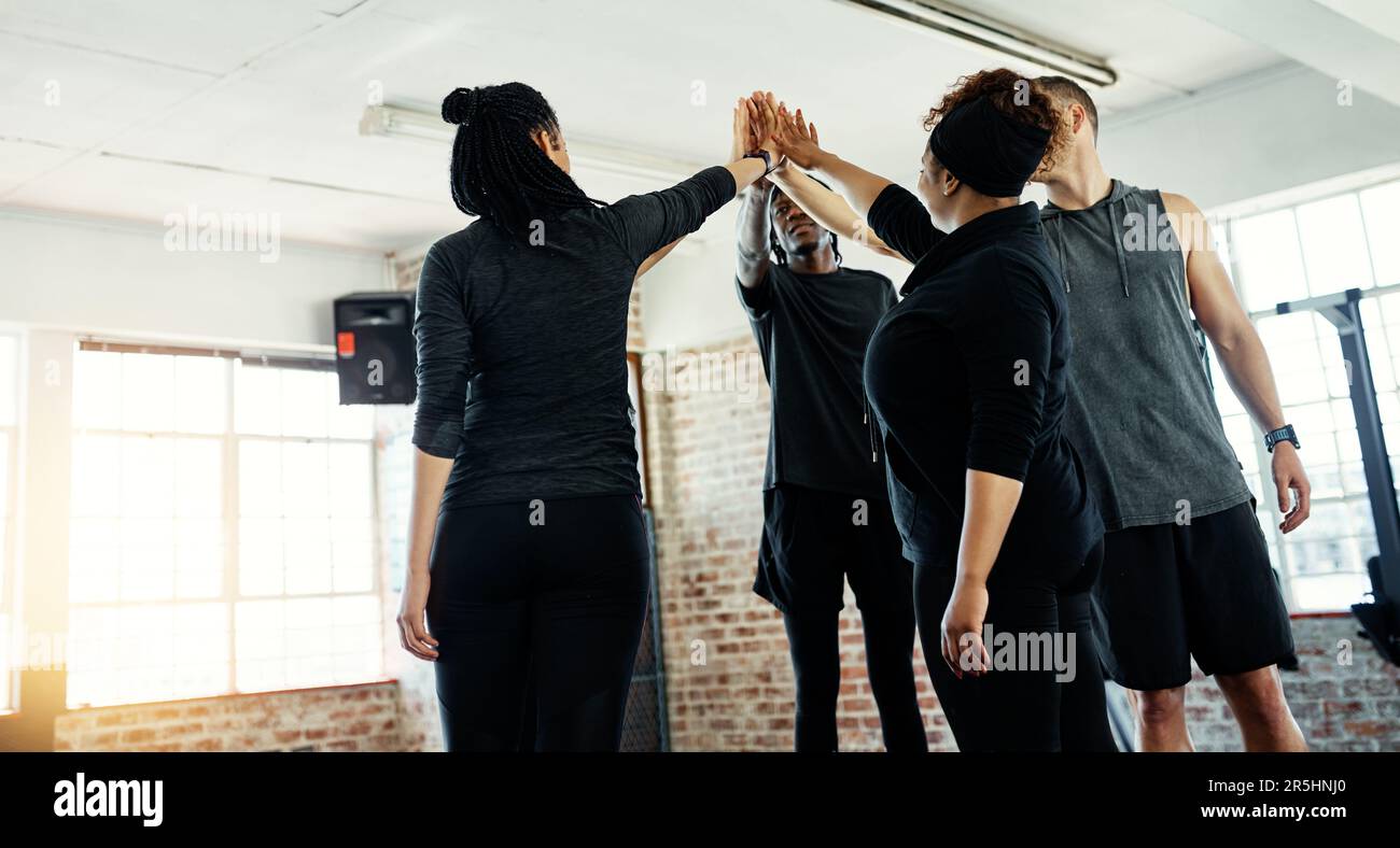 All about that fitness. a cheerful young group of people forming a ...