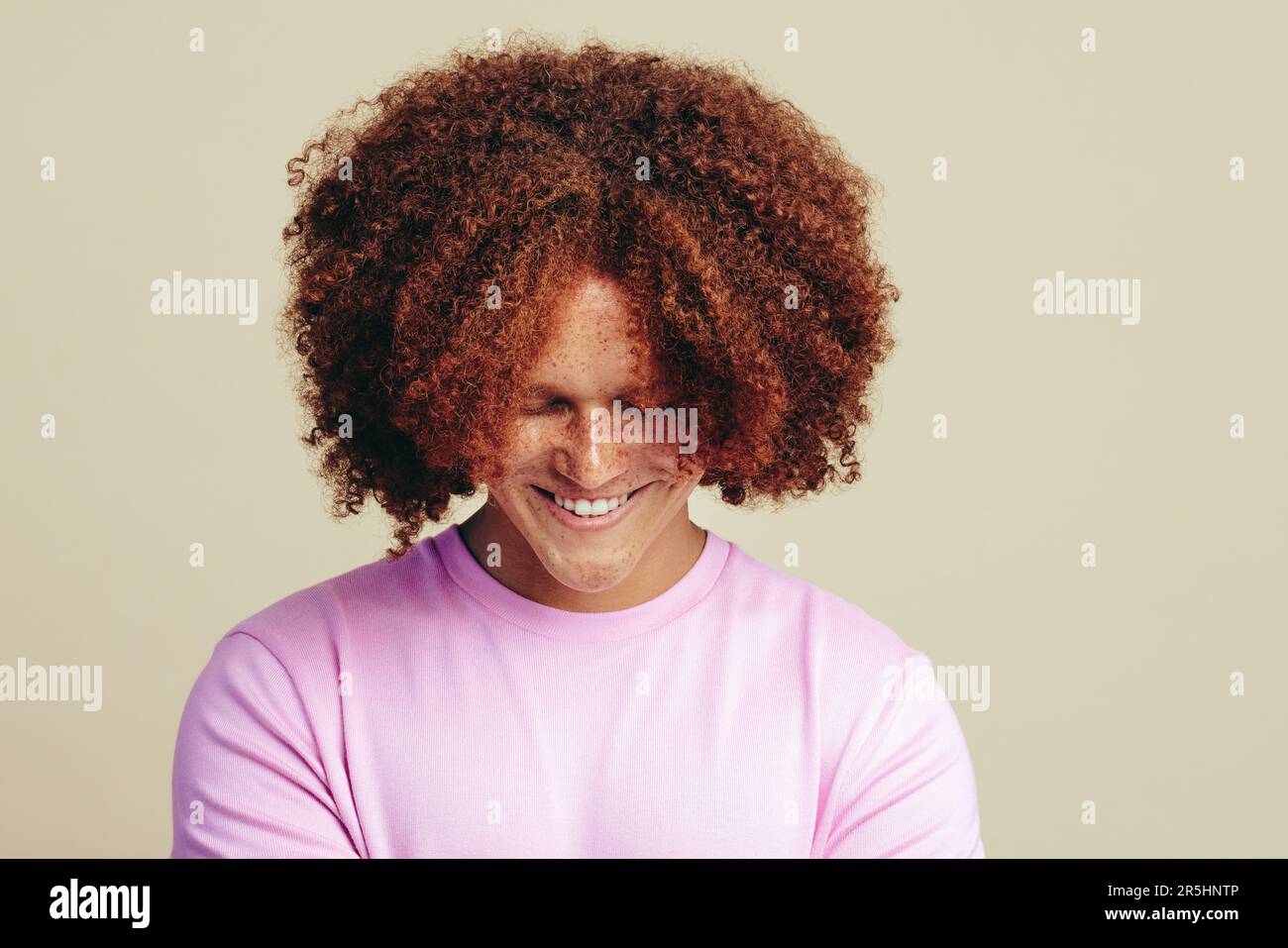 Handsome young man celebrating his unique skin and beautiful hair in a ...
