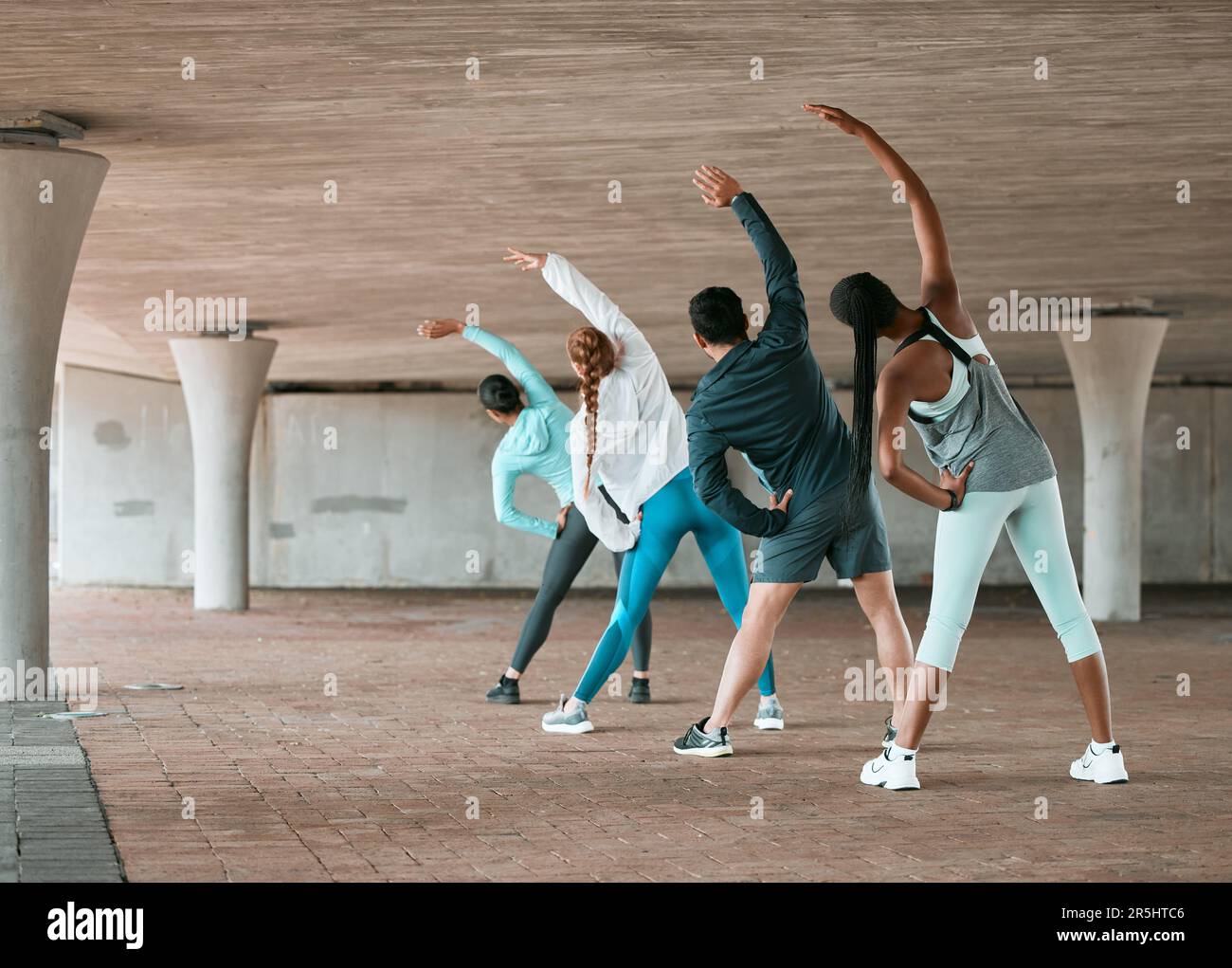 Group, workout and team stretching as a fitness club for sports, health ...