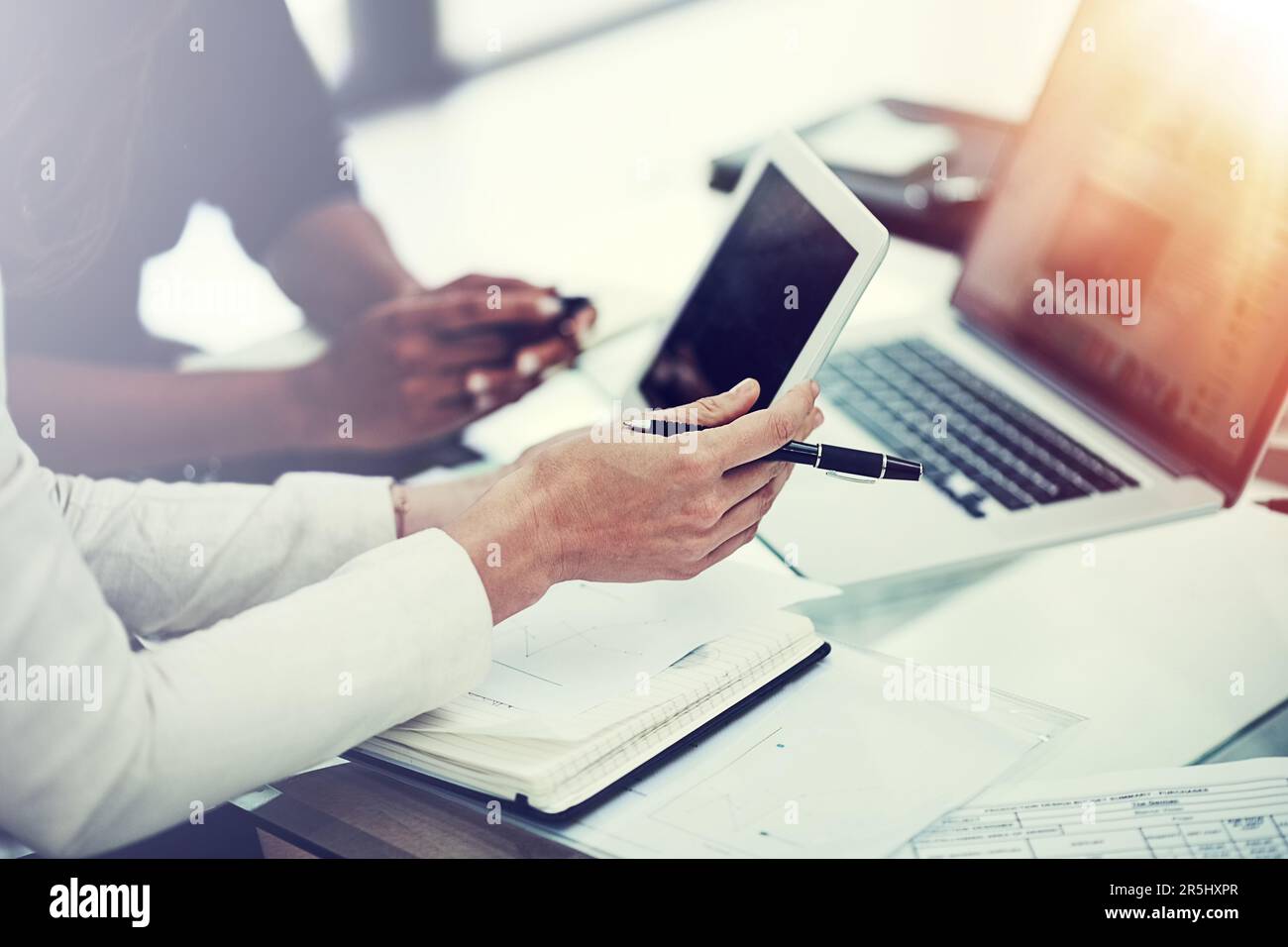 Smart tools to maximize productivity. two colleagues using a digital ...