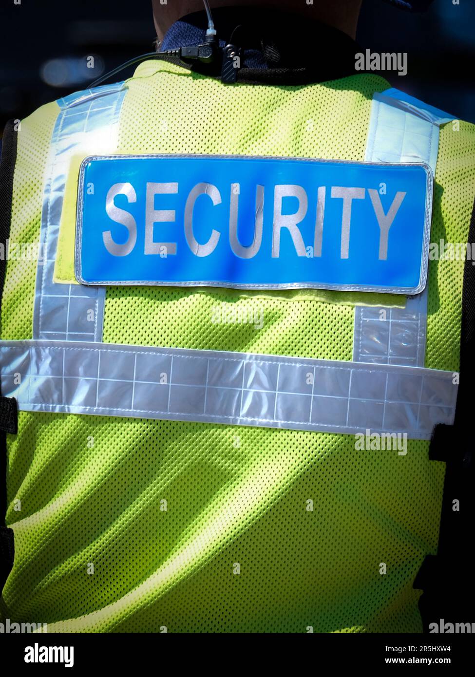 Photo of a security guard showing the word 'security' on his back Stock ...