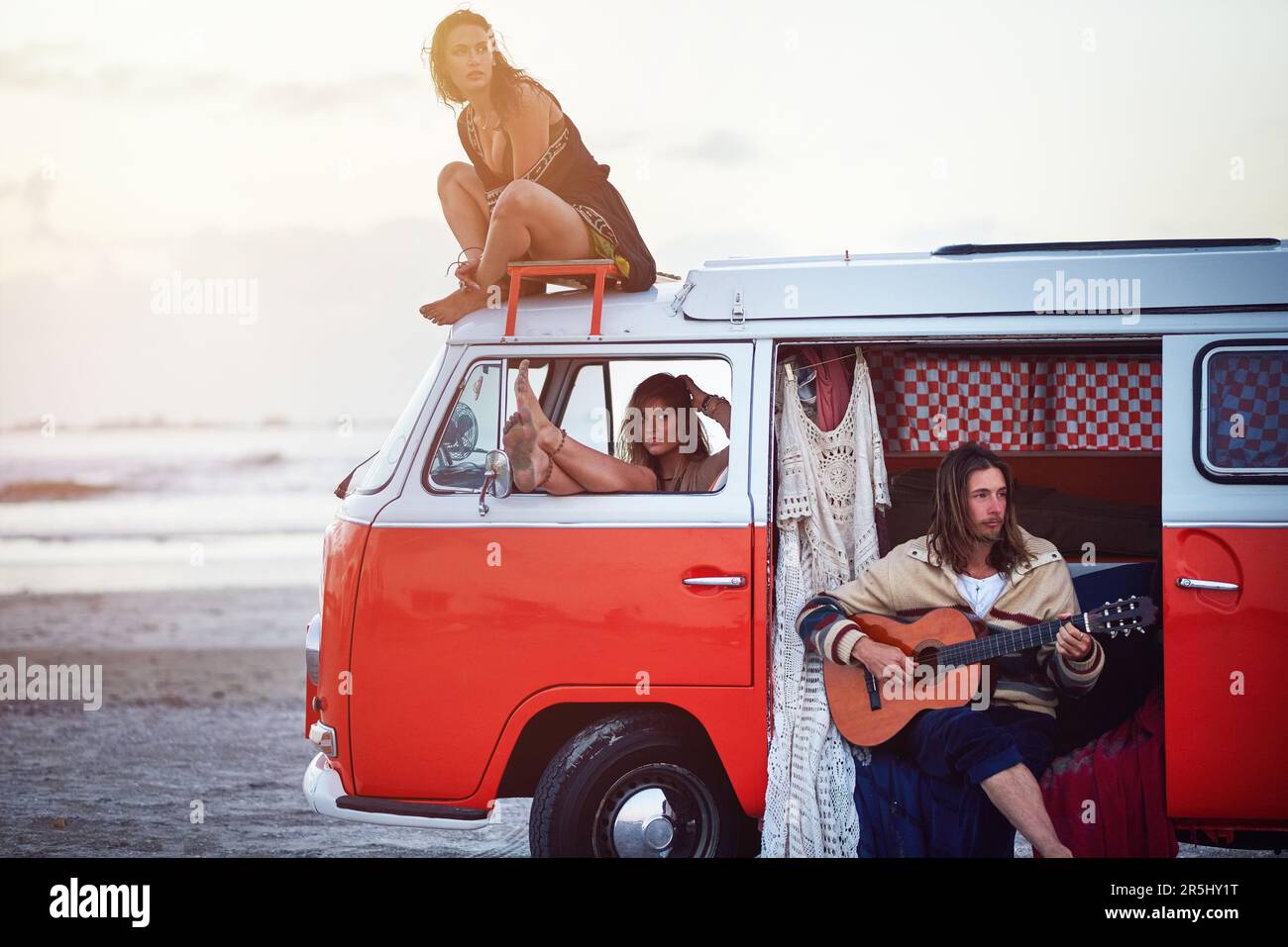 Making a quick stop on the beach. a group of young friends stopping at ...