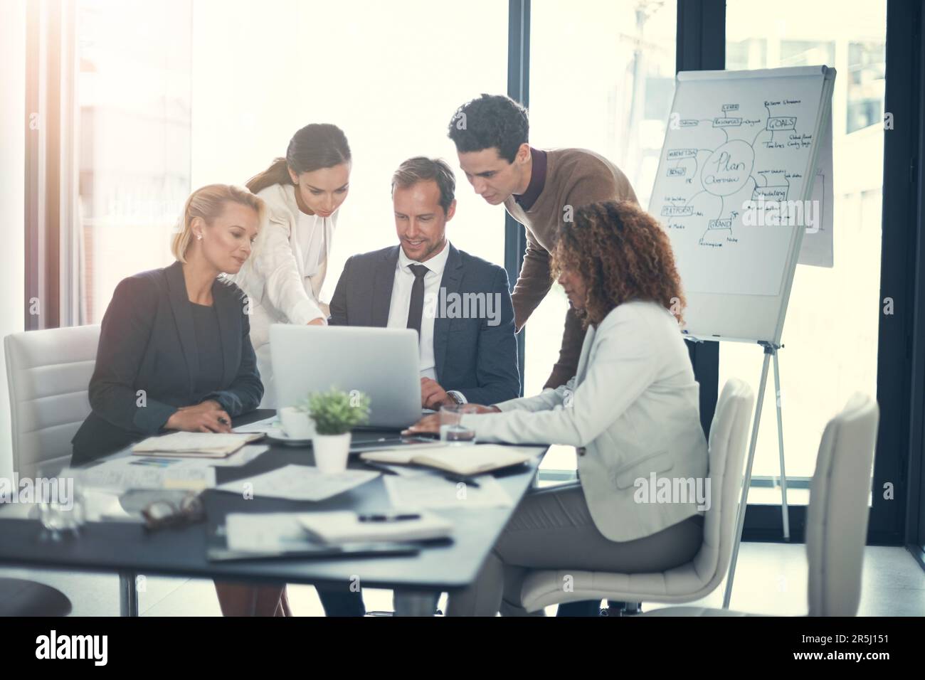 Getting things done with teamwork. a group of corporate businesspeople ...