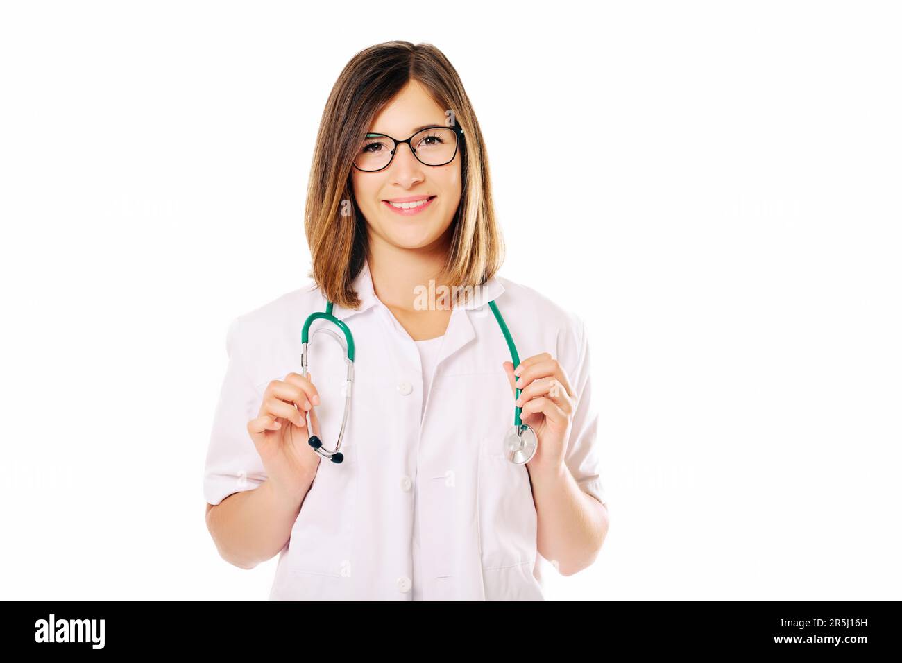 Studio portrait of young female doctor posing on white background Stock ...
