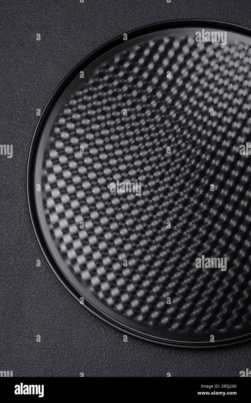 Round metal black detachable baking dish for baking on a dark concrete ...