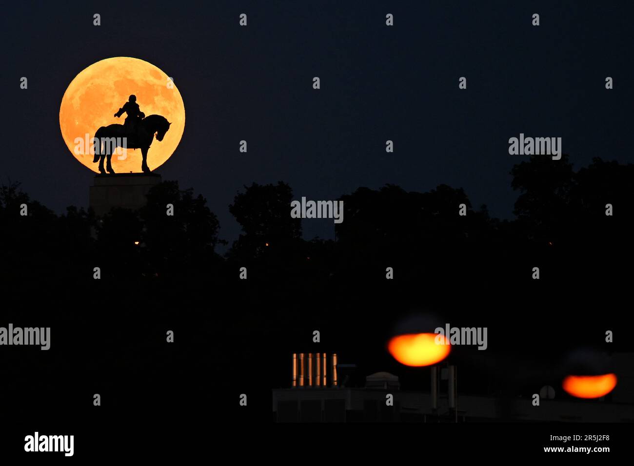 Prague, Czech Republic. 03rd June, 2023. Moonrise behind the equestrian ...