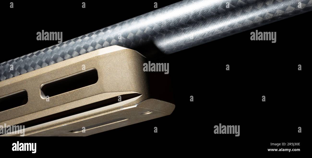 Slots and holes on a precision rifle with carbon barrel for attaching a ...
