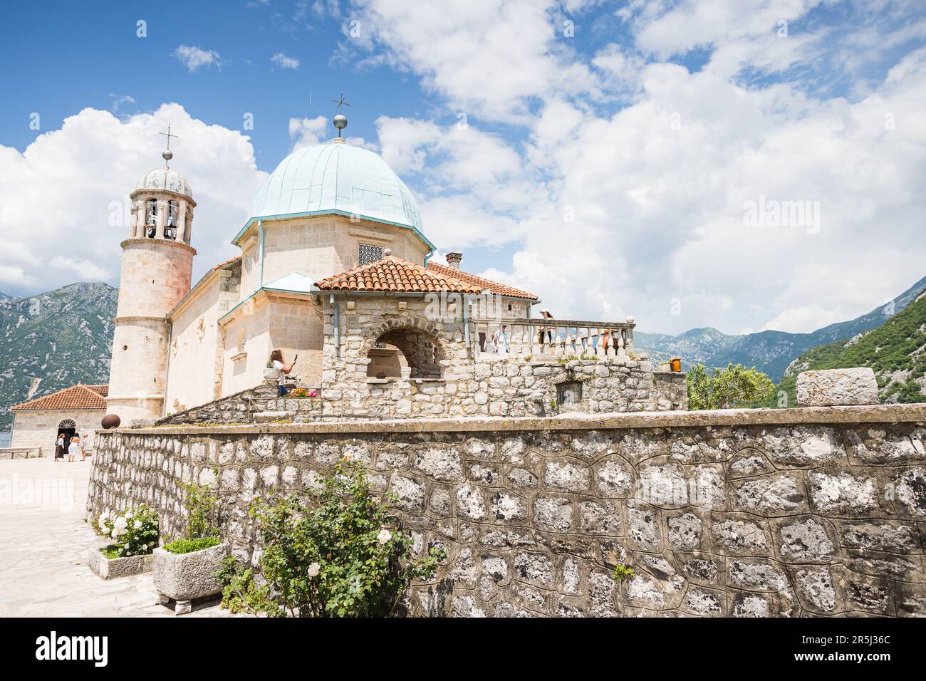 Our Lady of the Rocks pictured on a man made island in the Bay of Kotor ...