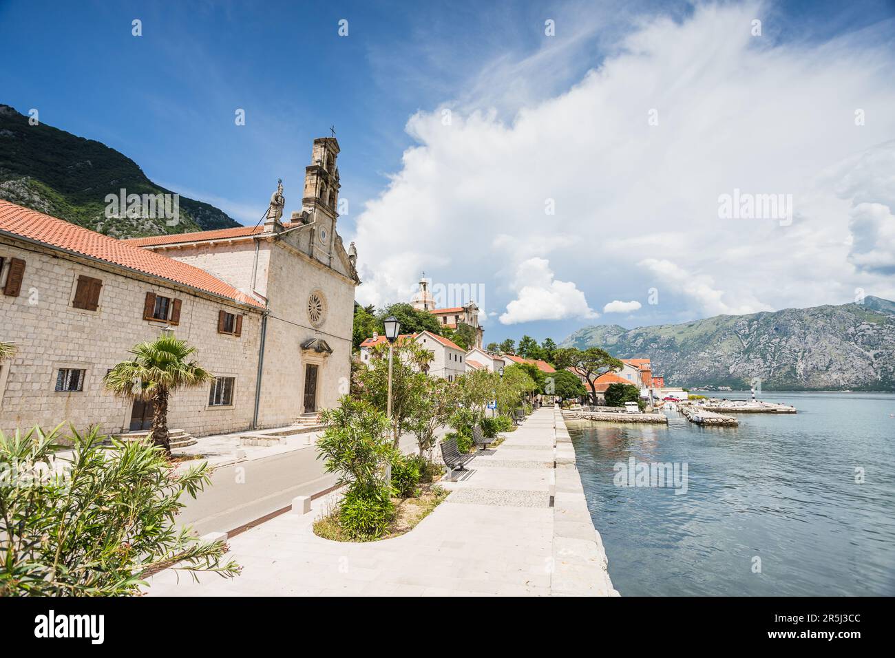 The pretty waterfront of Prcanj seen on the edge of the Bay of Kotor in ...