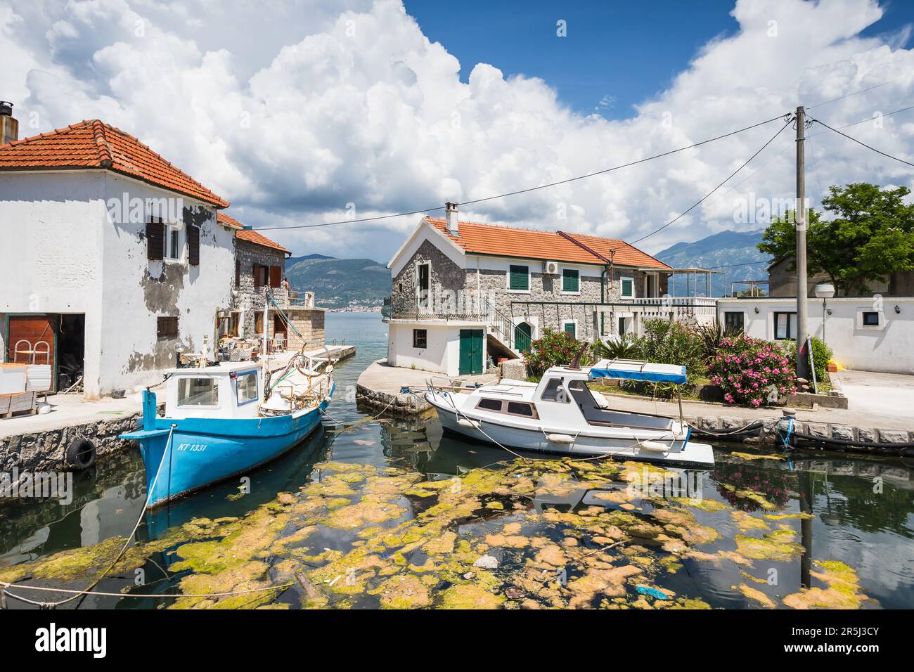 Small boats in the pretty village of Bjelila on the Montenegro ...