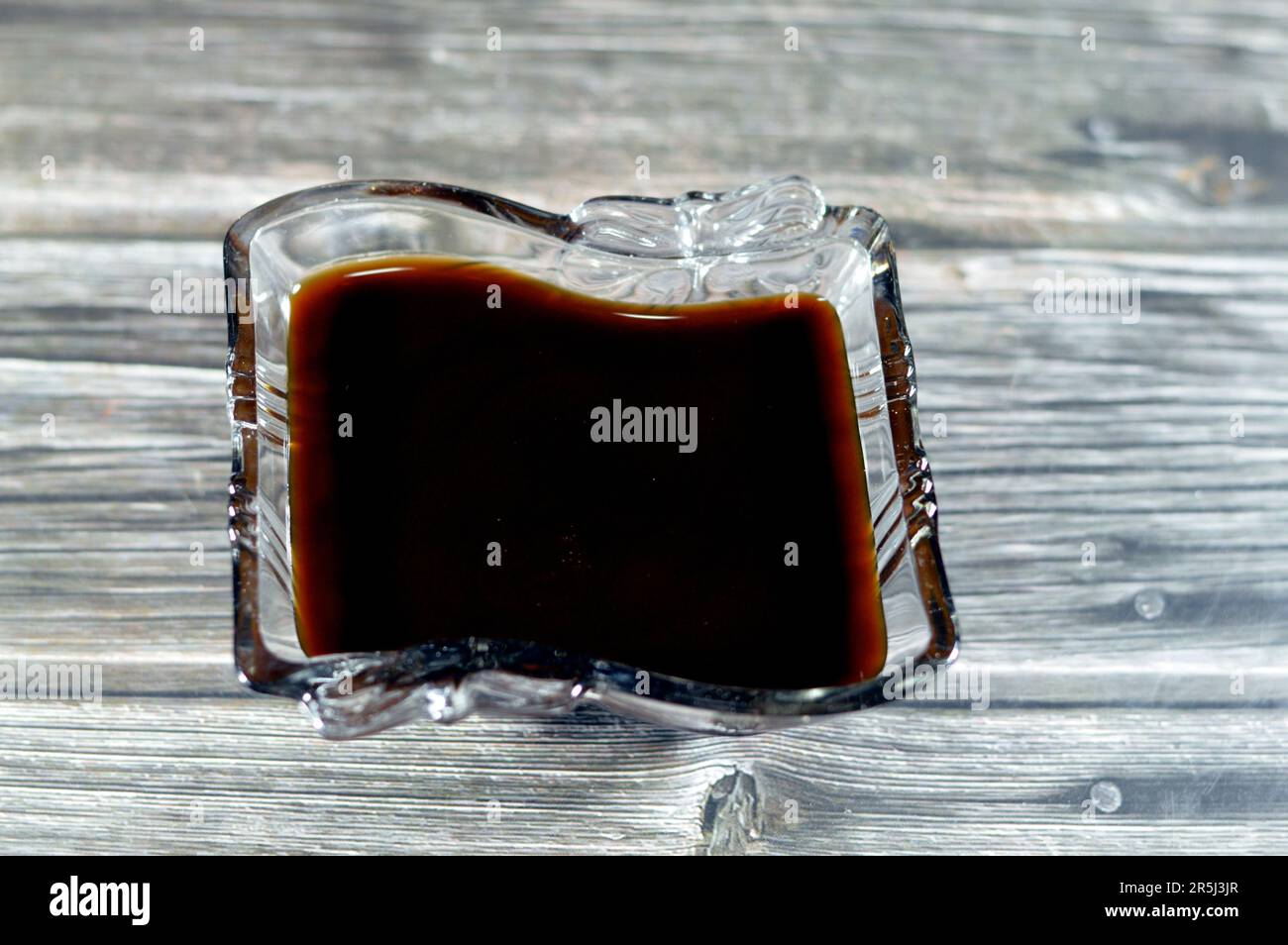 Molasses, a viscous substance resulting from refining sugarcane or ...