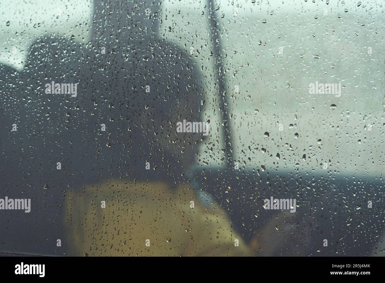 Sad young woman sitting lonely and depressed inside a car through ...