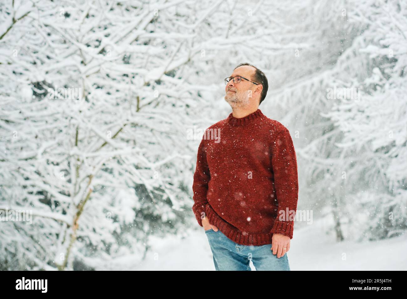 Outdoor portrait of middle age 55 - 60 year old man enjoying nice cold ...