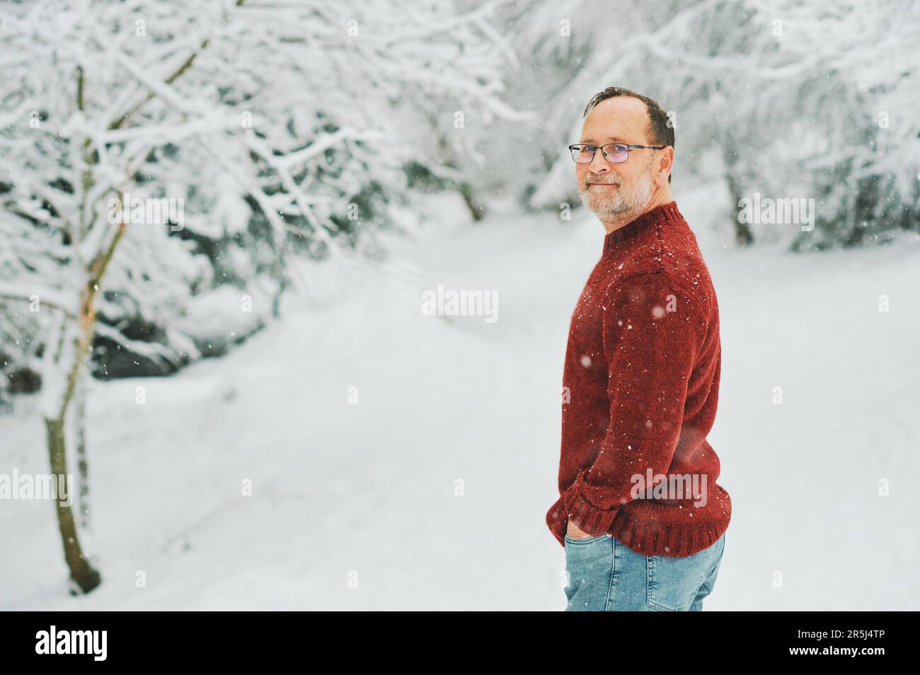 Outdoor portrait of middle age 55 - 60 year old man enjoying nice cold ...