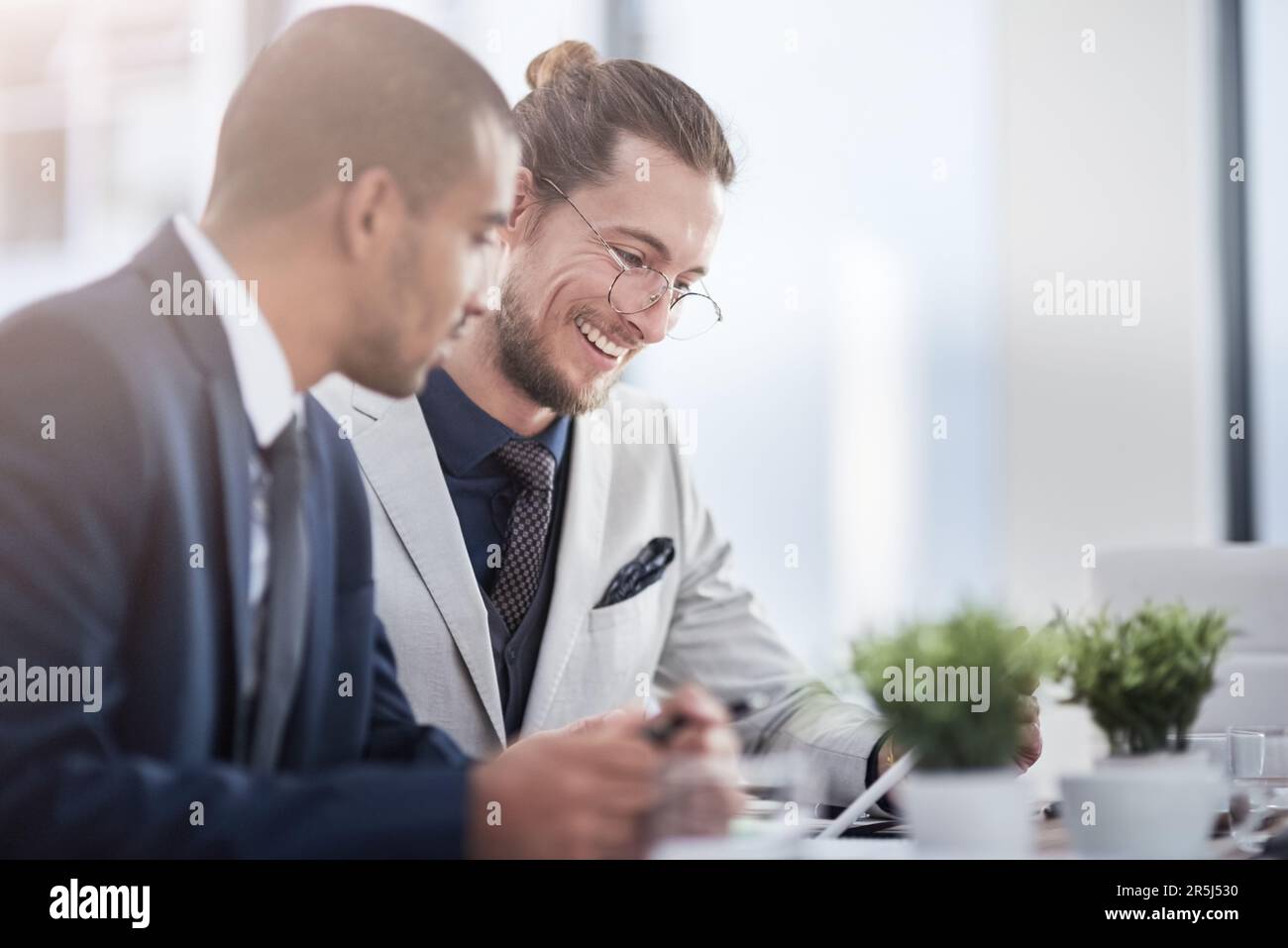 Improving productive output with teamwork and technology. two young ...