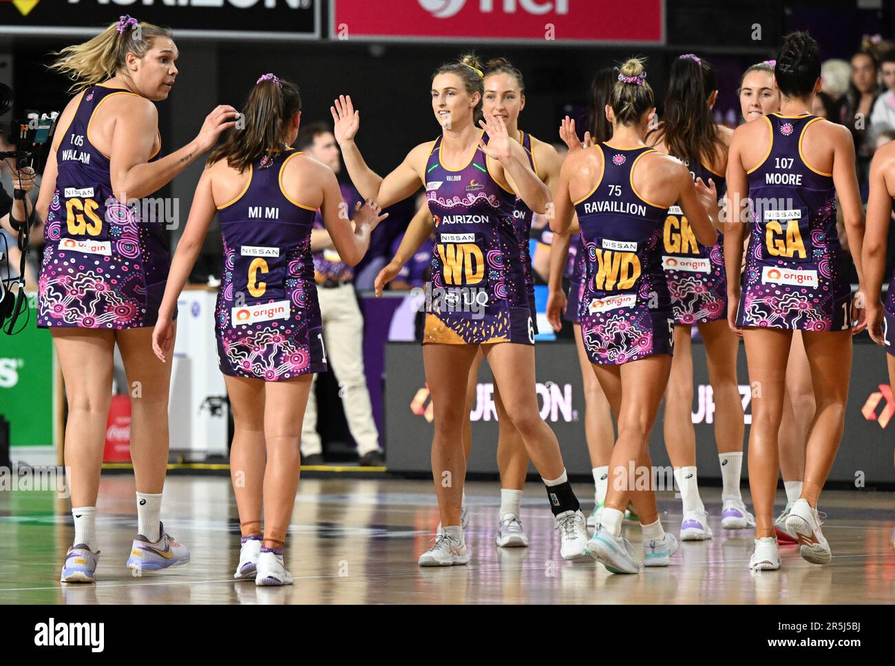 Gabi Simpson (centre) of the Firebirds celebrates with team mates ...