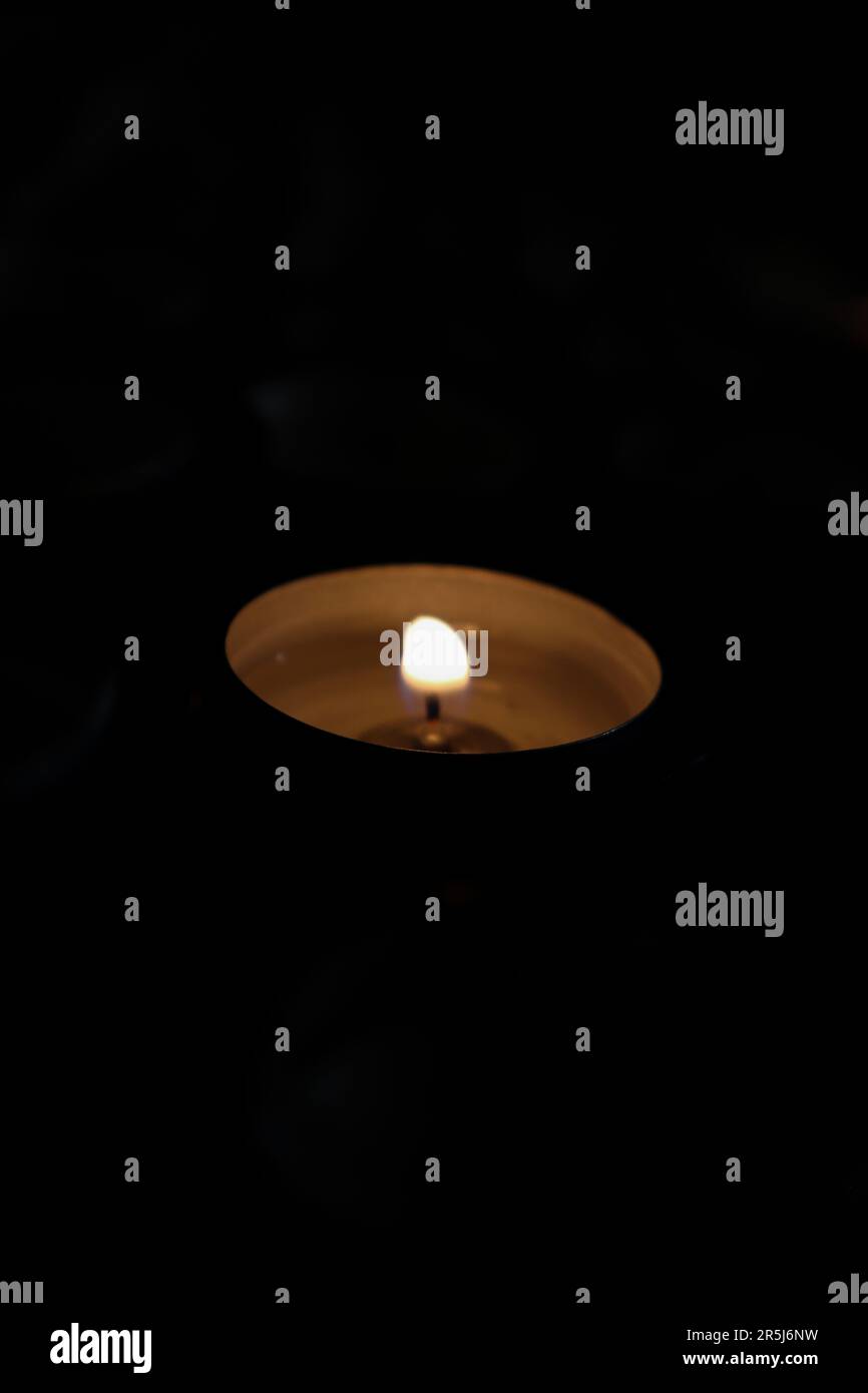A Closed up Picture of Little Candle in the Dark as the Only Source of ...