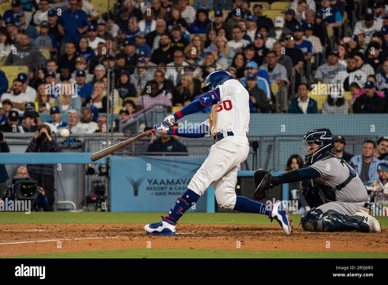 Los Angeles Dodgers right fielder Mookie Betts (50) homers for the ...