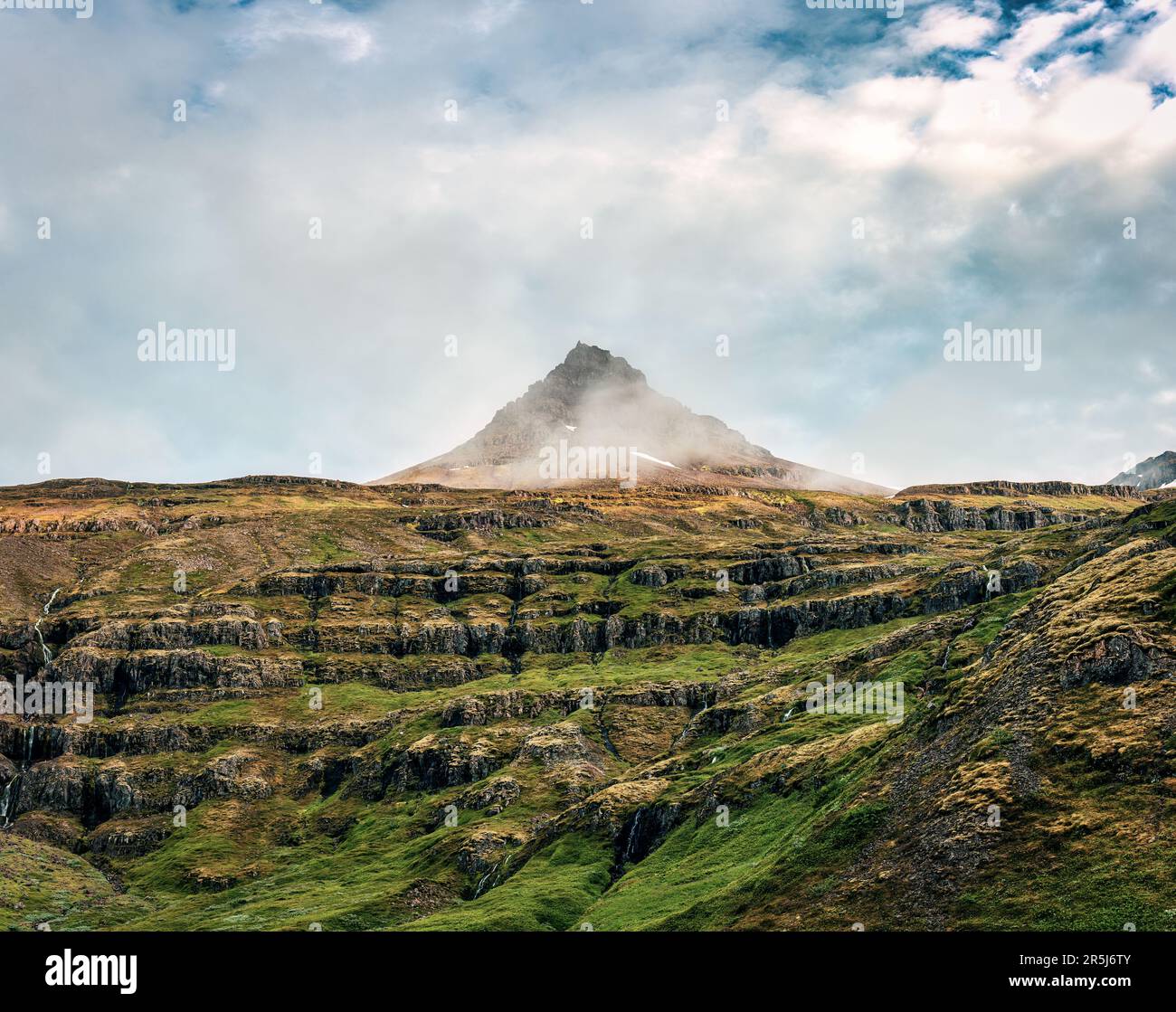 Majestic landscape of rugged volcanic pyramid shape and ...