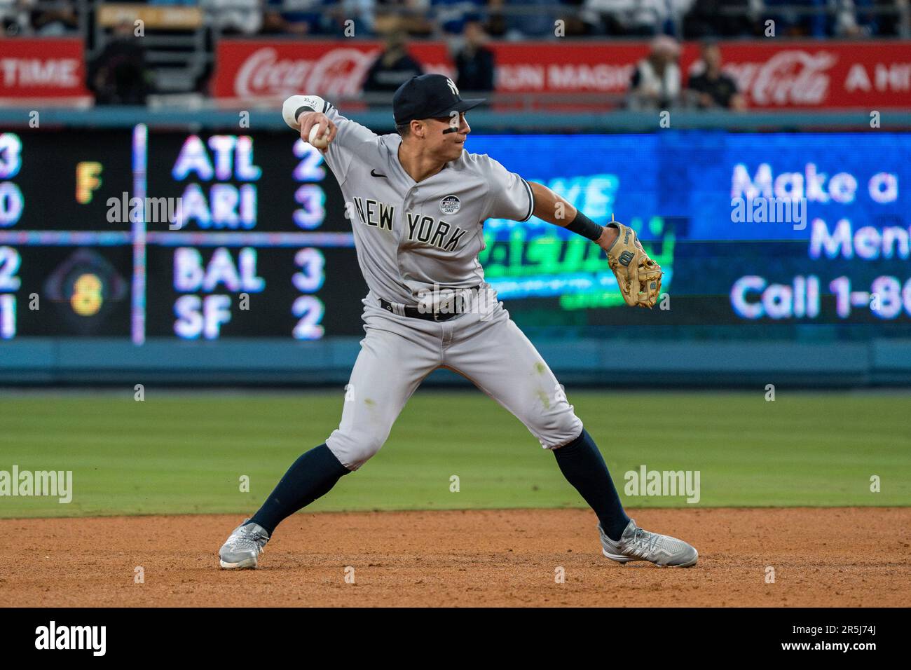 New York Yankees shortstop Anthony Volpe (11) throws to first base for an out during a MLB game ...