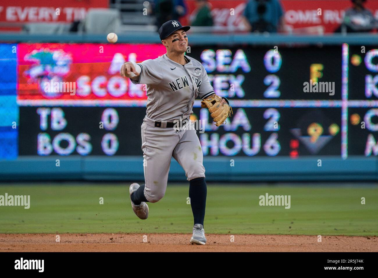 New York Yankees shortstop Anthony Volpe (11) throws to first base for ...